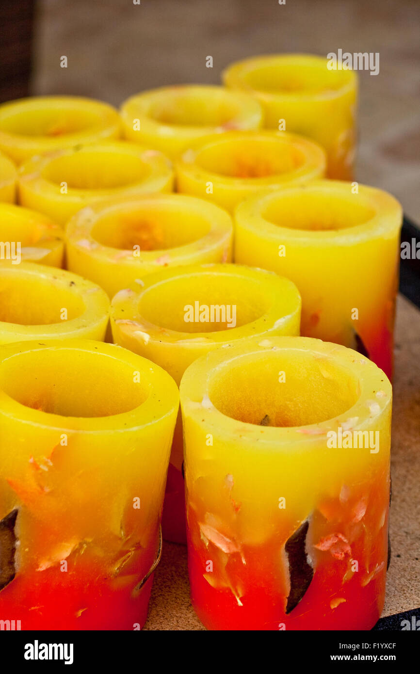 close up of a lot of Yellow candles Stock Photo - Alamy