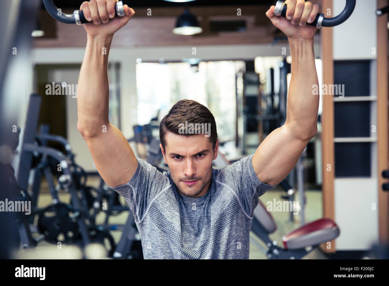 Portrait of a handsome man workout in fitness gym Stock Photo - Alamy