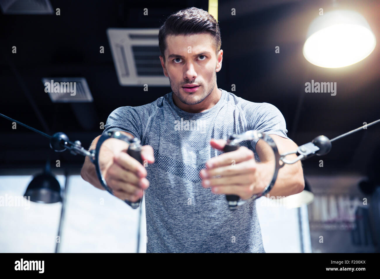 Portrait of a man workout on fitness machine in gym Stock Photo - Alamy