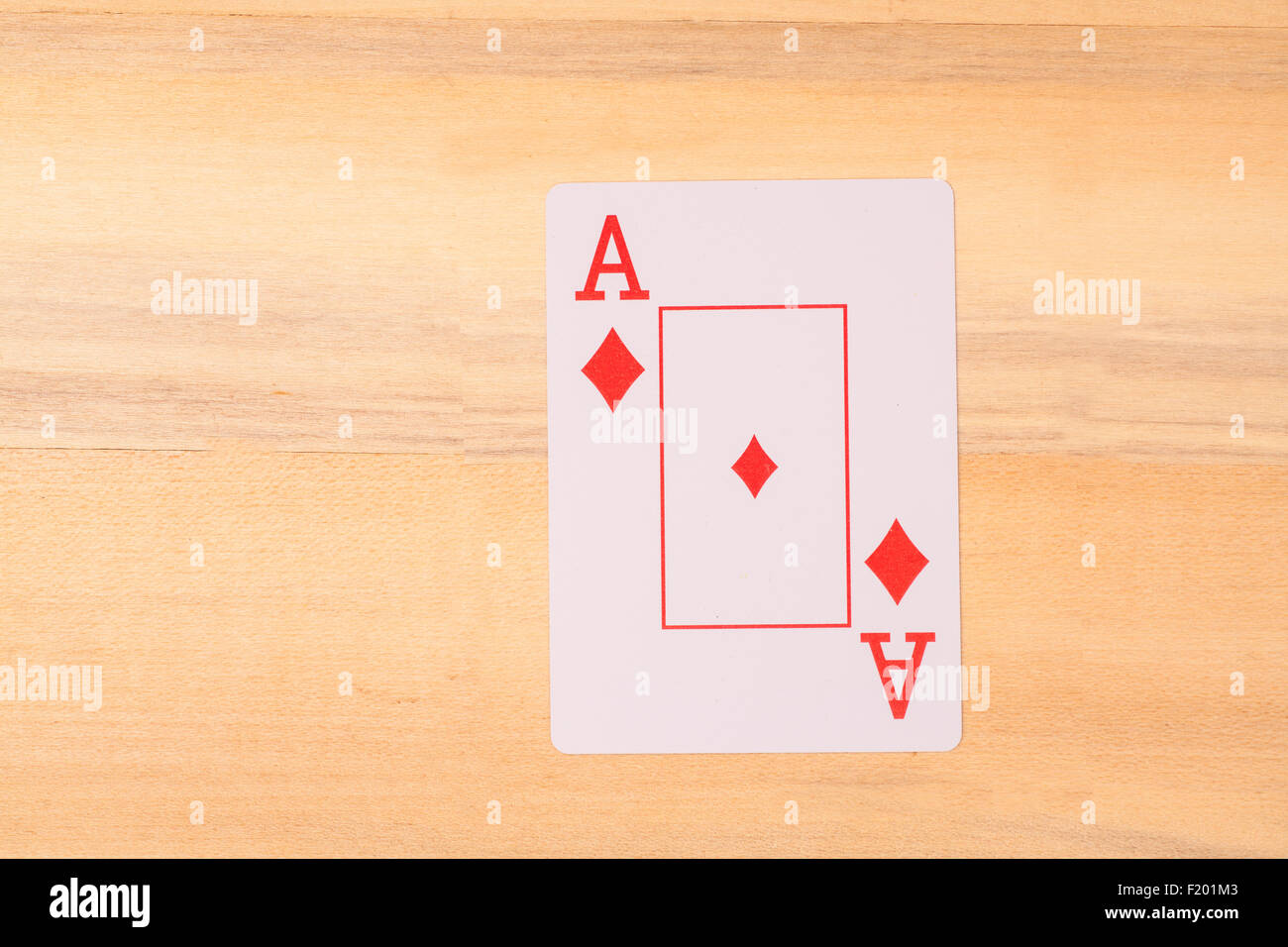 ace of playing card on wooden table Stock Photo - Alamy