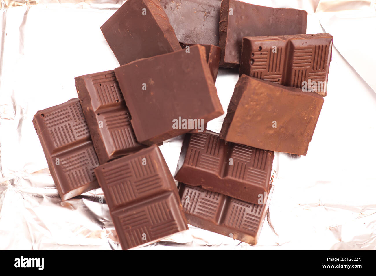 Broken chocolate on a aluminum foil Stock Photo - Alamy