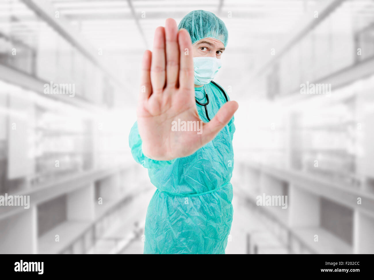 young male doctor going stop with his hand at the hospital Stock Photo ...