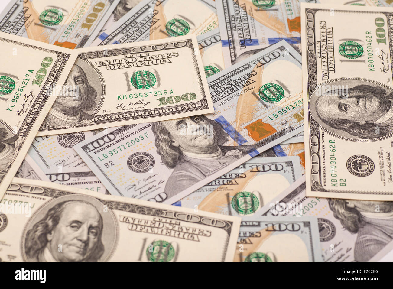 One hundred dollars pile as background Stock Photo - Alamy