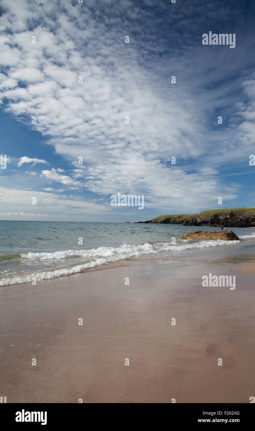 Waves lap gently at the beach at Porth Oer / Whistling Sands, Aberdaron ...