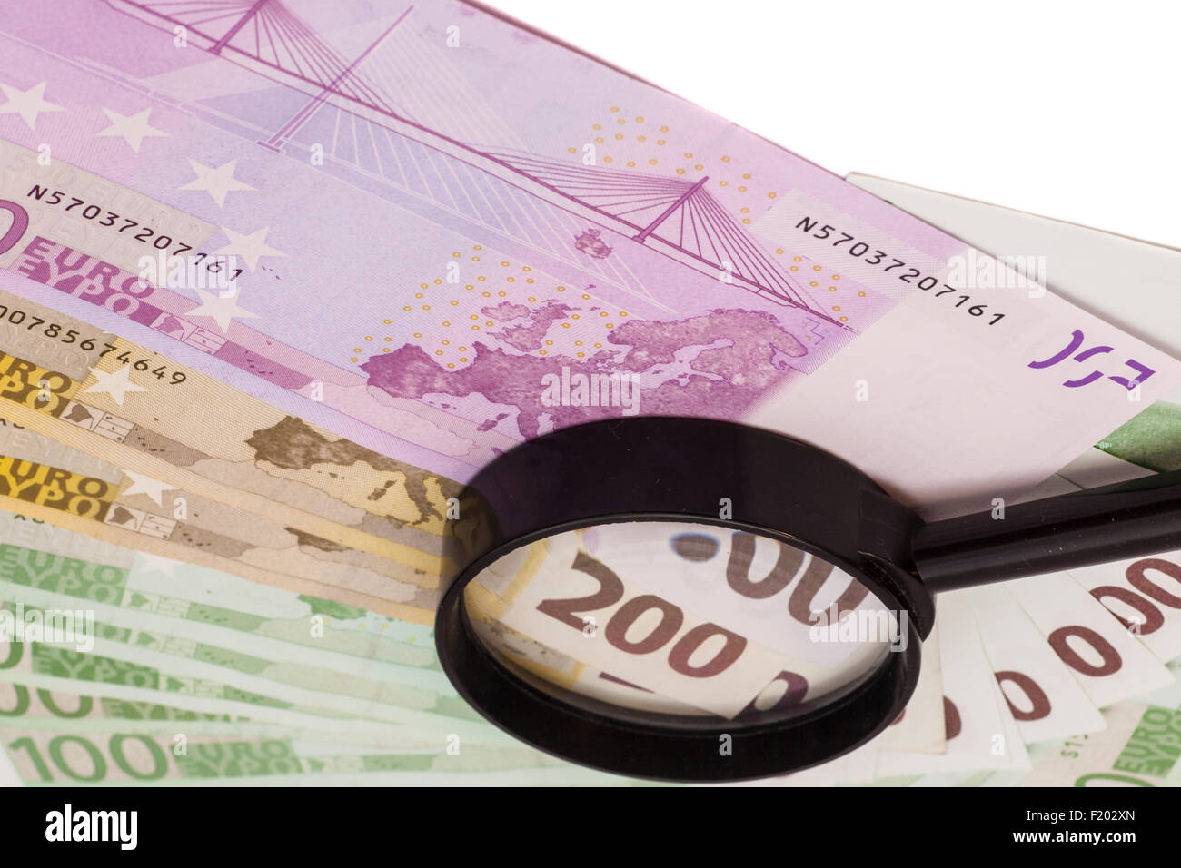 Euro banknote under magnifying glass Stock Photo - Alamy