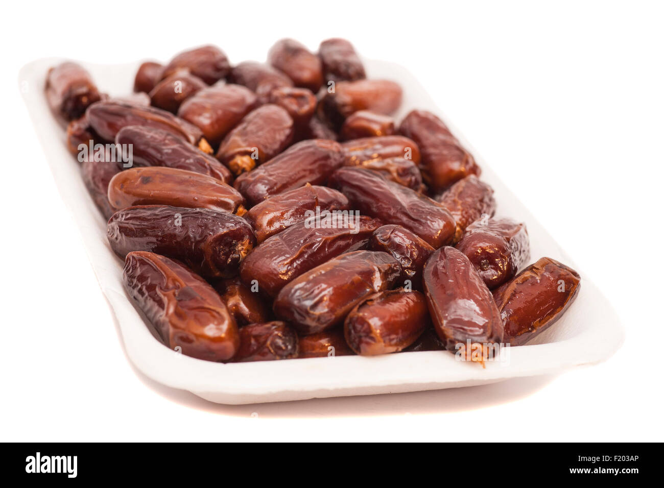 Dates isolated on white background Stock Photo - Alamy
