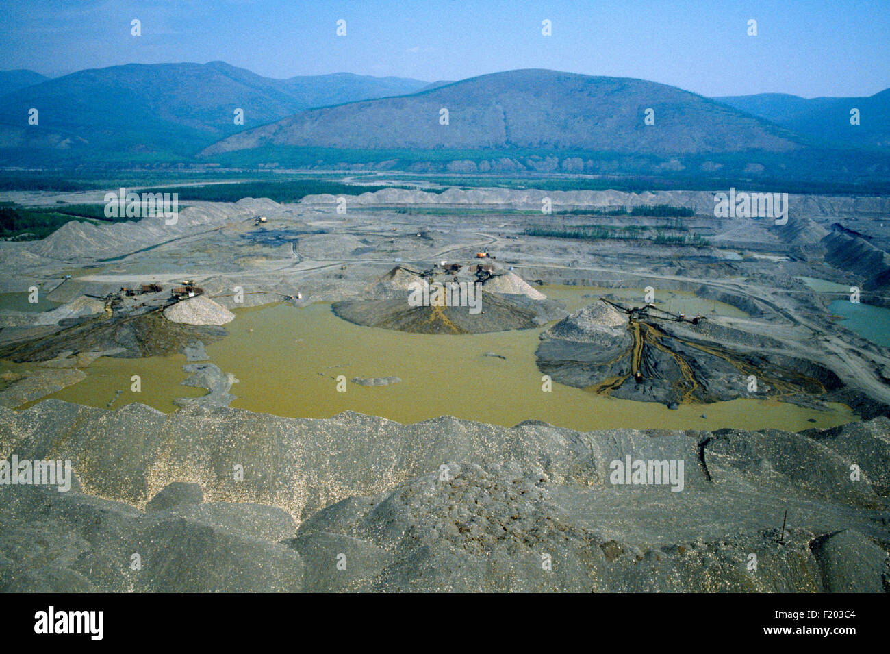 Russia, Siberia, east of Yakutsk, open cast gold mine in a wide valley ...