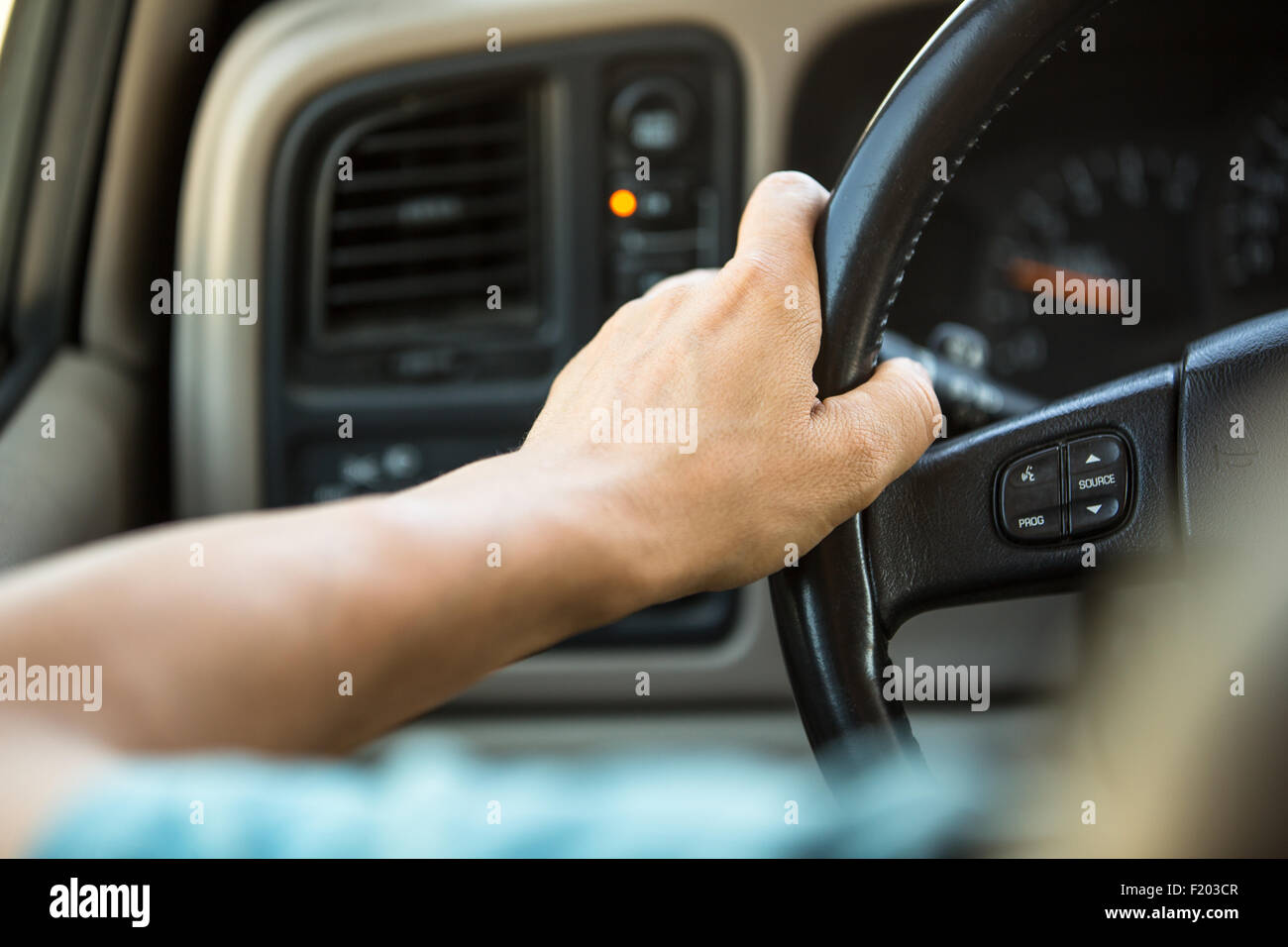 Driver's hands on the steering wheel Stock Photo - Alamy