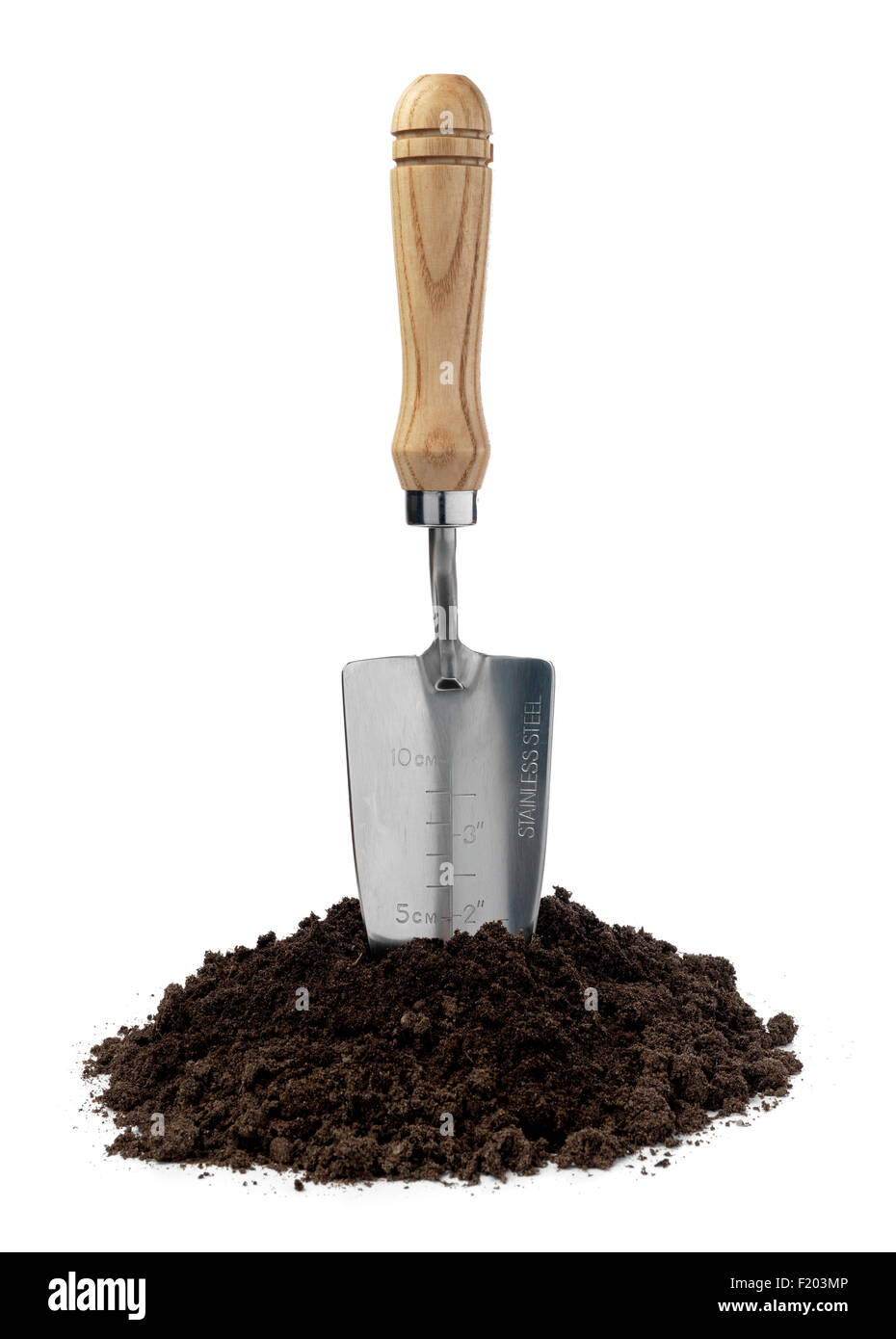 soil with garden trowel isolated on a white background Stock Photo - Alamy
