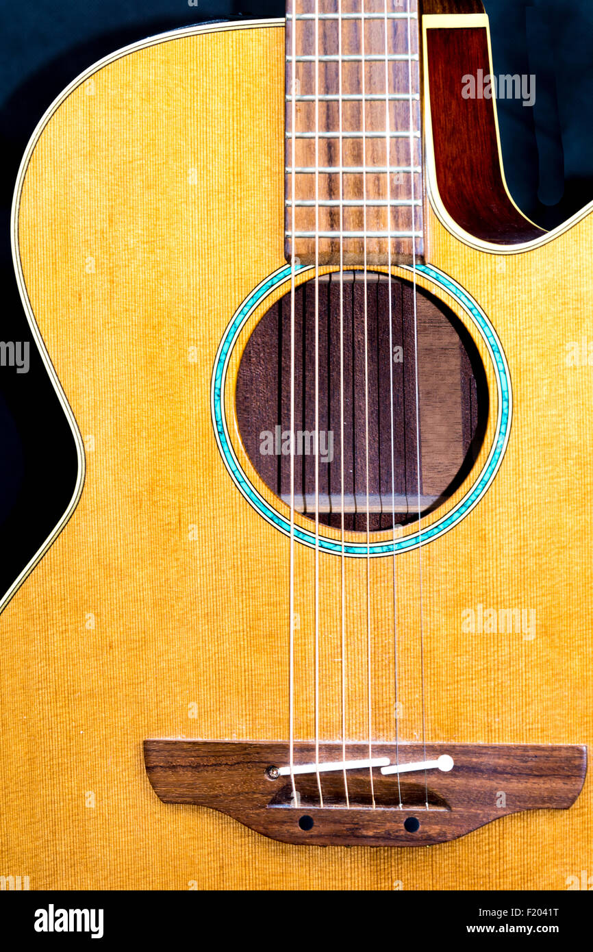Closeup of golden colour acoustic guitar Stock Photo - Alamy