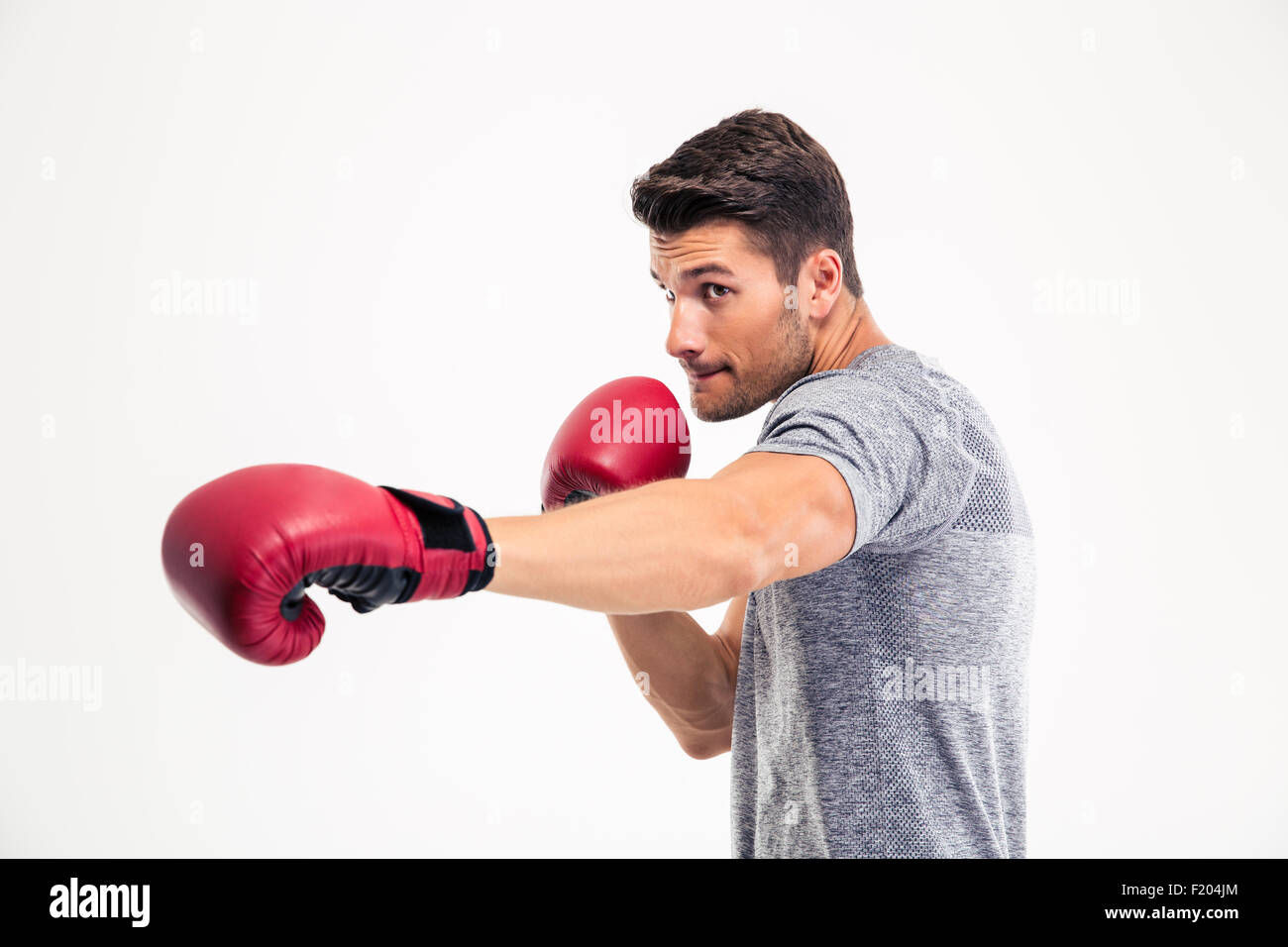 Portrait of a handsome man boxing isolated on a white background Stock ...