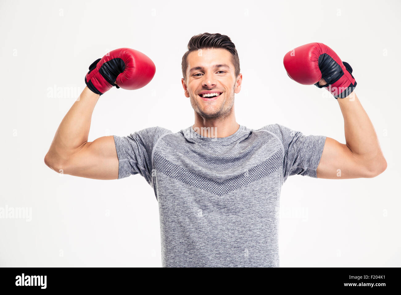 Portrait of a happy male boxer celebrating his success isolated on a ...