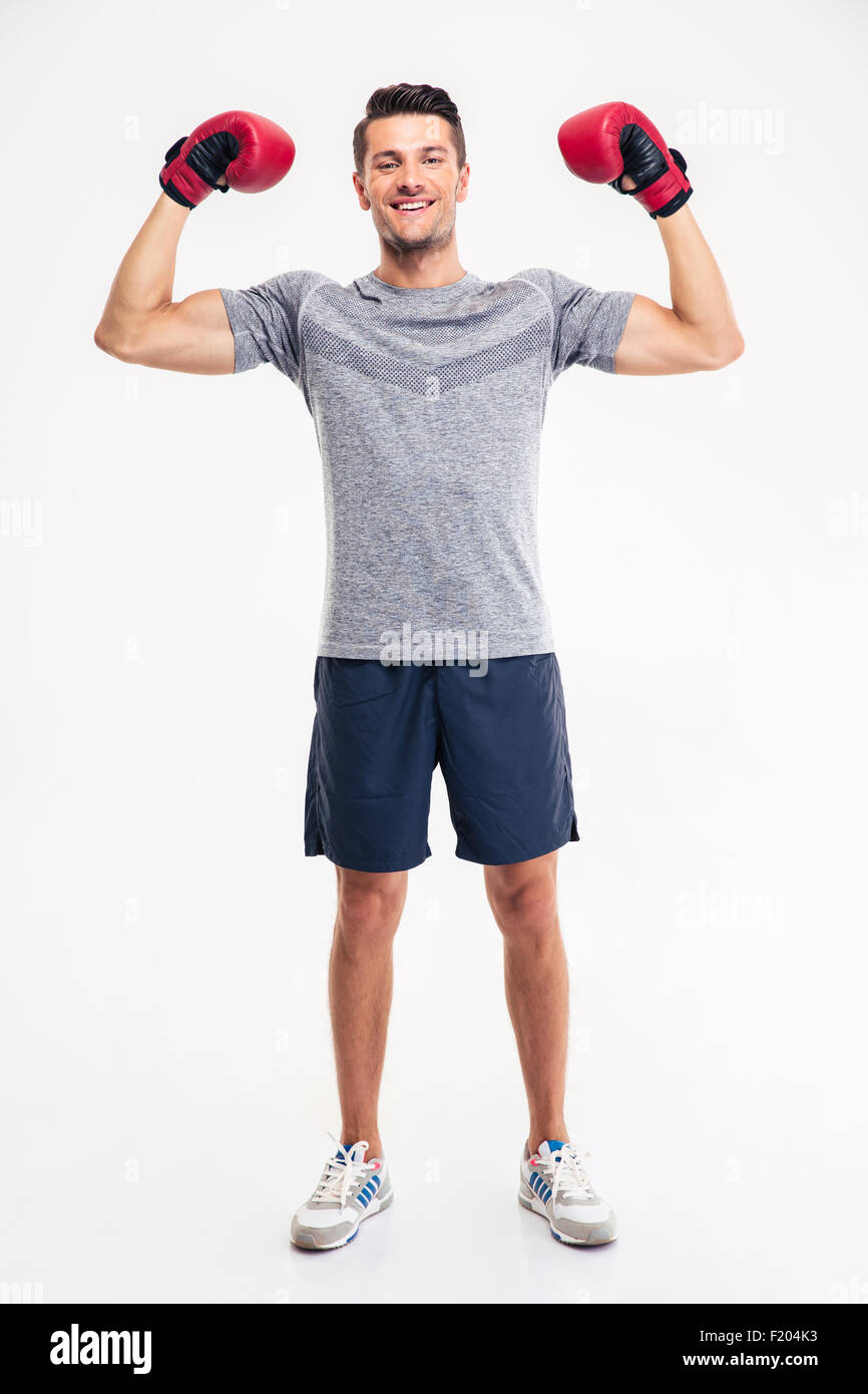 Full length portrait of a smiling male boxer celebrating his success ...