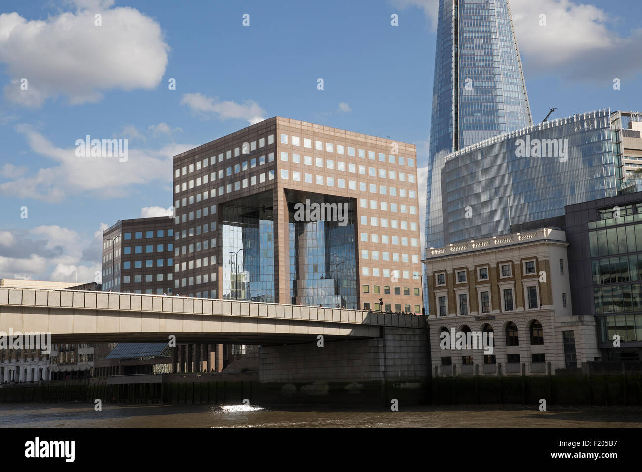 One London Bridge and the Shard as seen from the River Thames in London ...