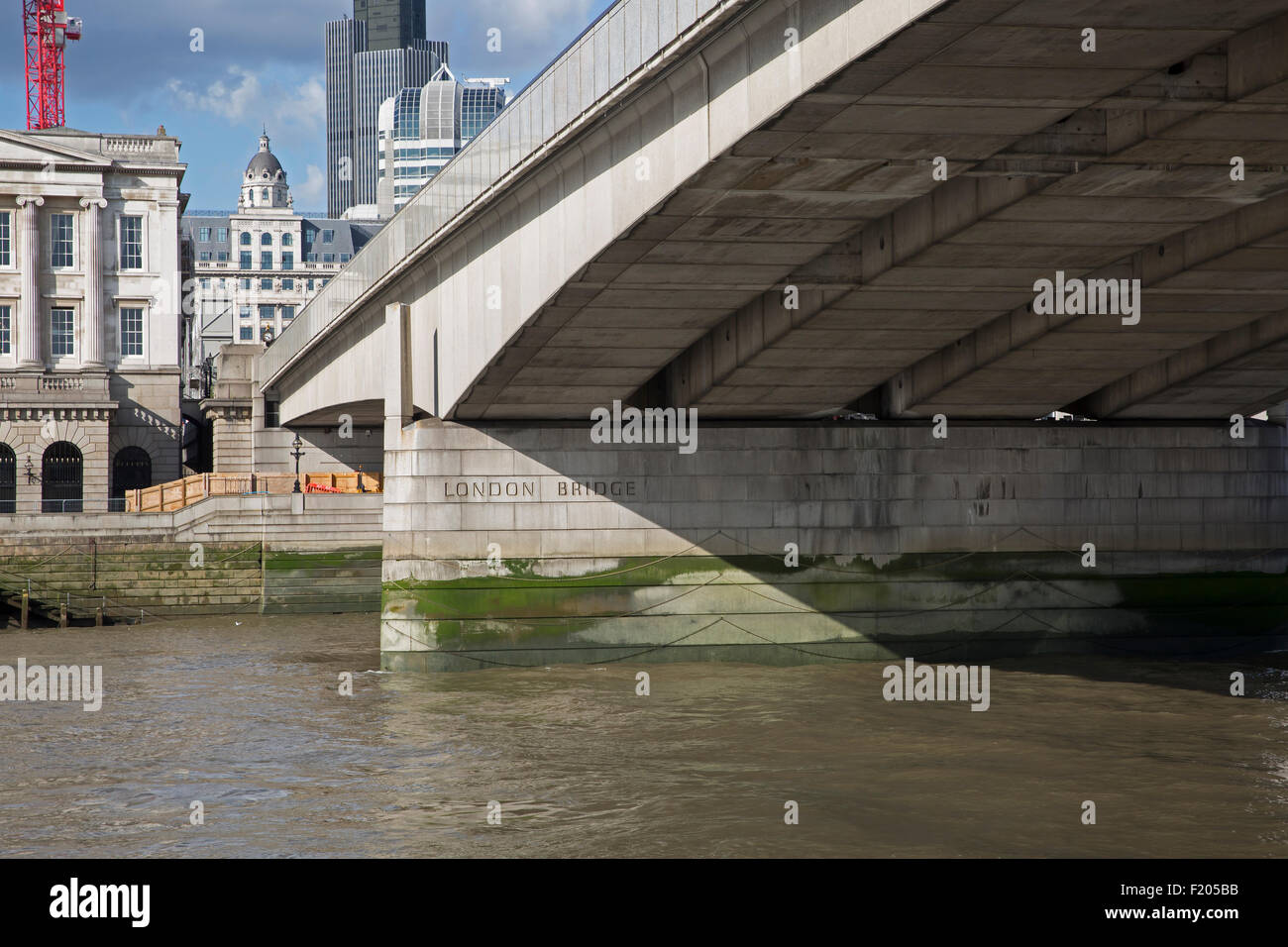 Passing under London Bridge on the River Thames Stock Photo - Alamy