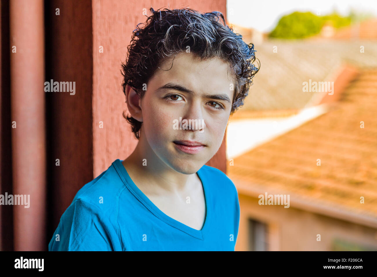 portrait of hispanic boy guy that inspires confidence in blue T-shirt ...