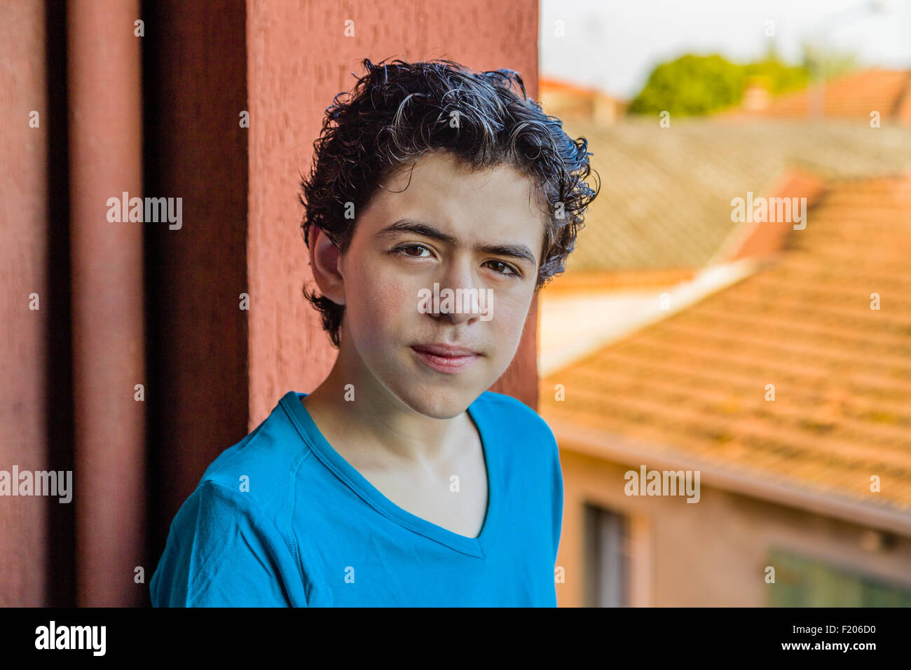 portrait of hispanic boy guy that inspires confidence in blue T-shirt ...