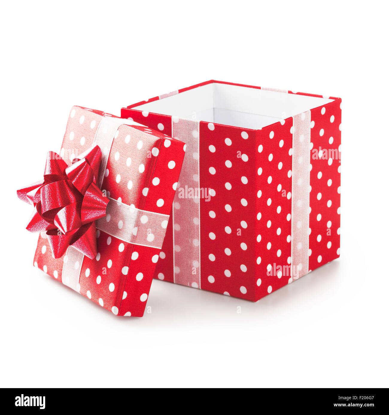 Open red gift box with white dots and ribbon bow. Holiday present ...