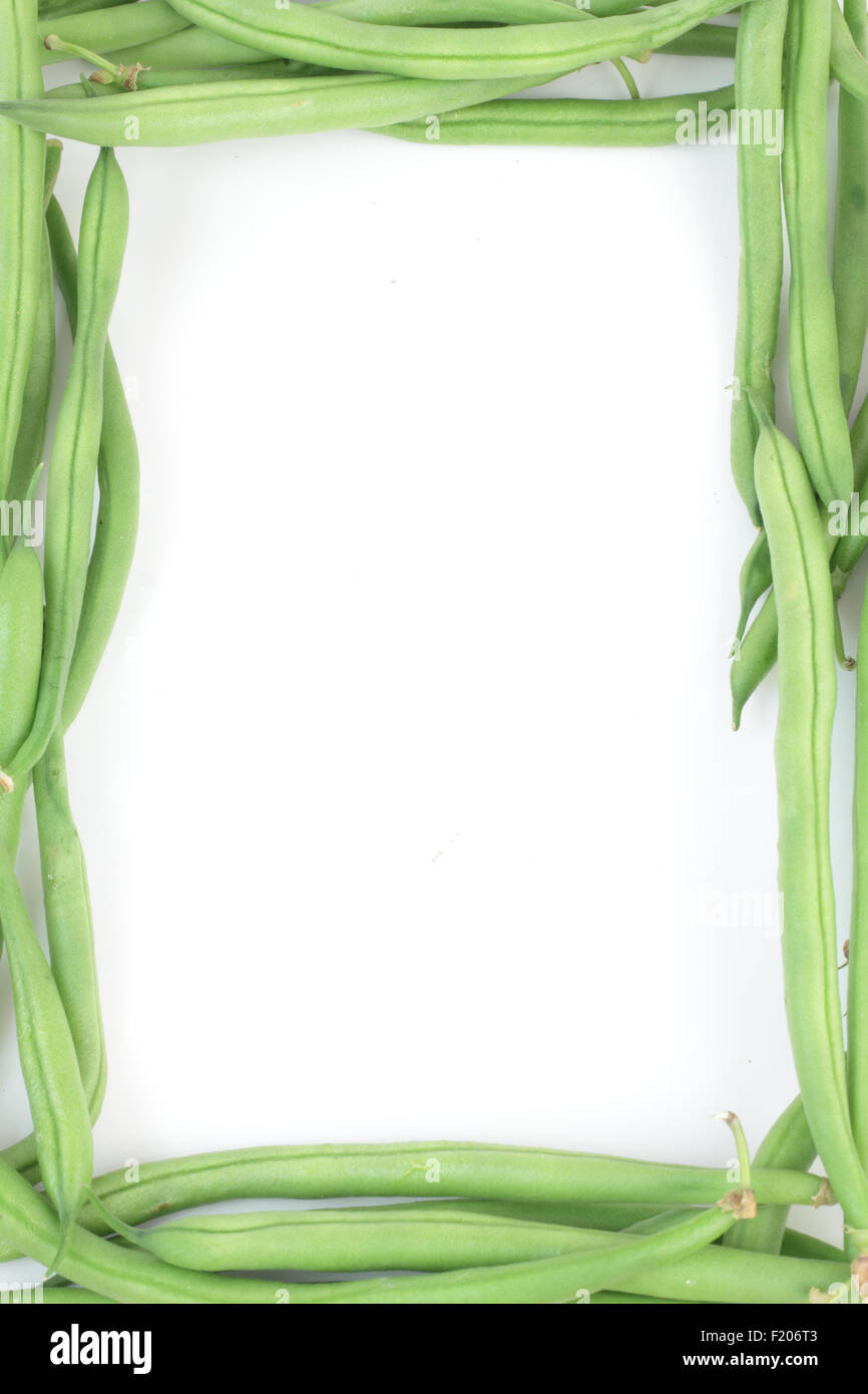 Bunch of fresh green beans formed in a frame, isolated on white Stock ...