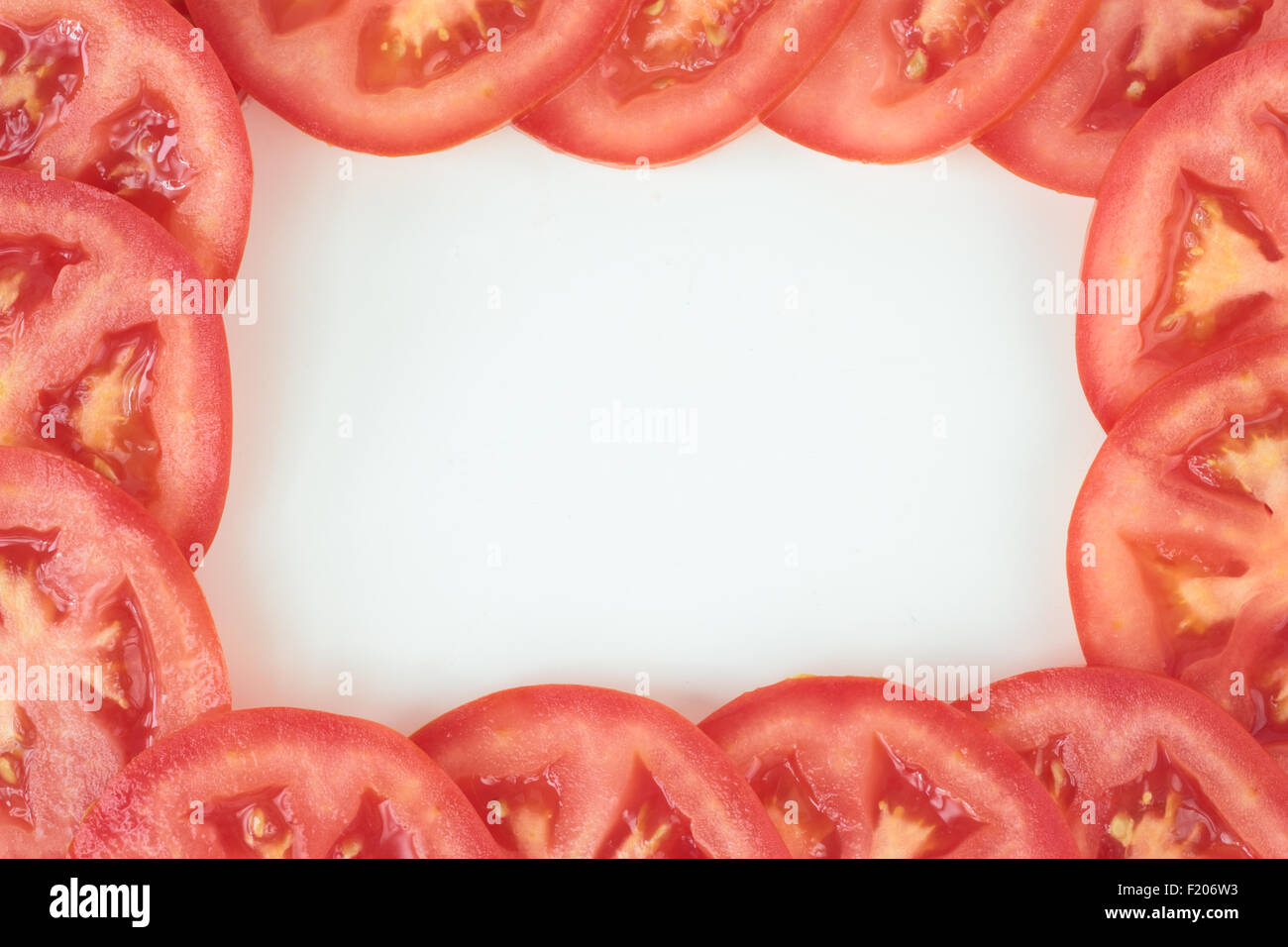 Tomato slices formed in an isolated food frame Stock Photo - Alamy