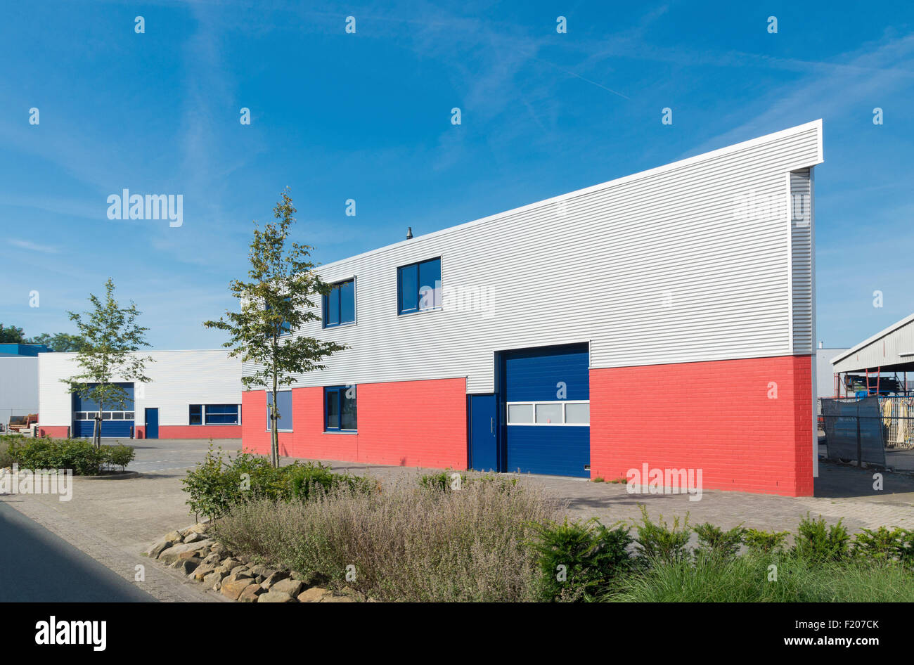 exterior of a modern warehouse building with office Stock Photo - Alamy