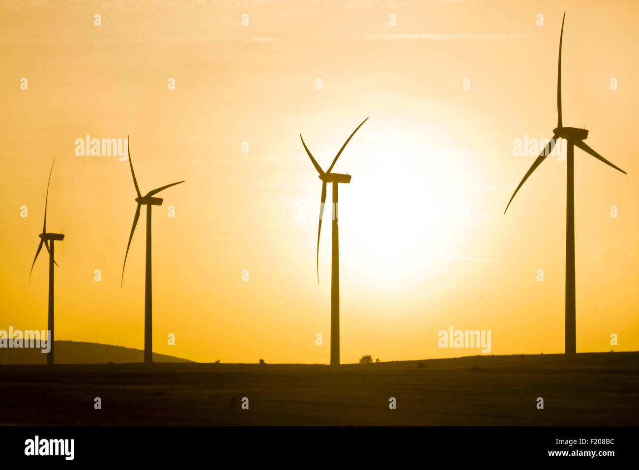 Wind turbines at sunset Stock Photo - Alamy