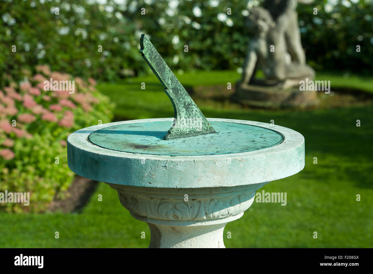 sundial in a garden setting Stock Photo - Alamy