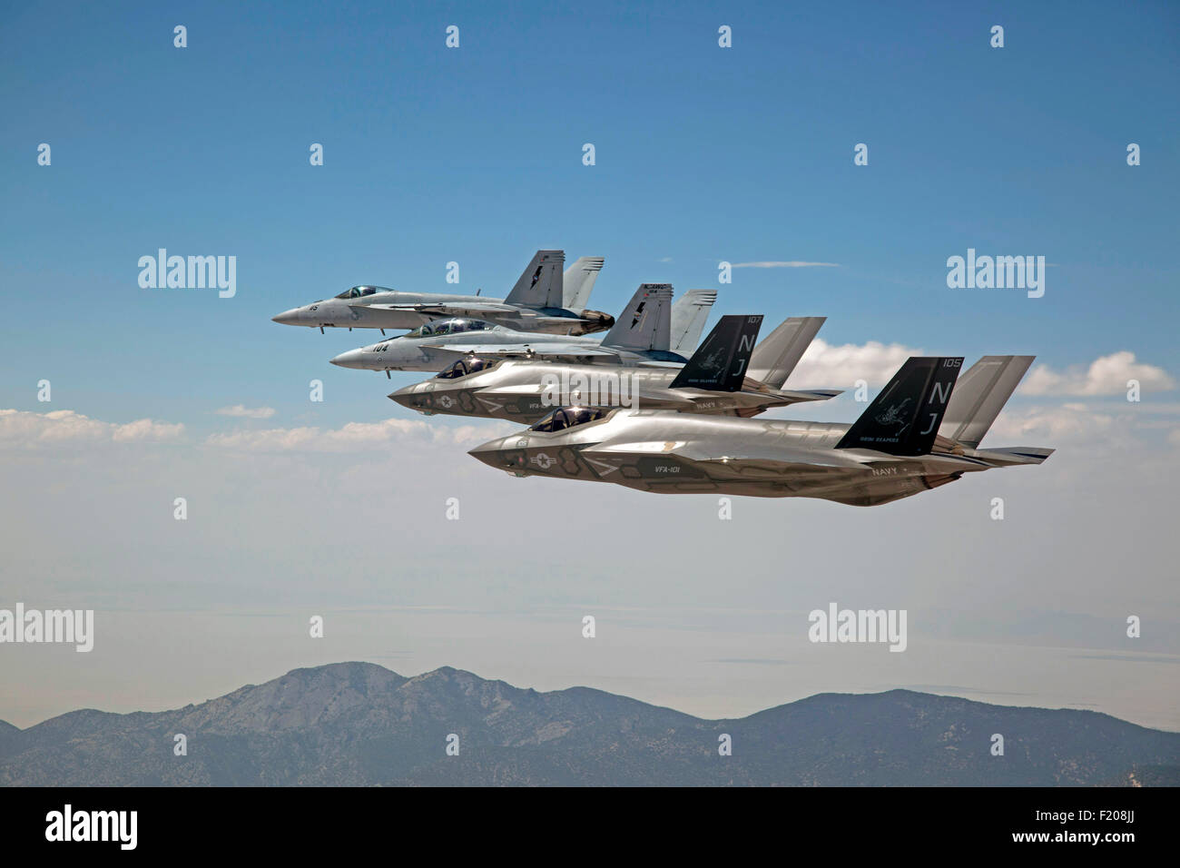 U.S. Navy F-35C Lightning II fighter aircraft fly in formation with ...