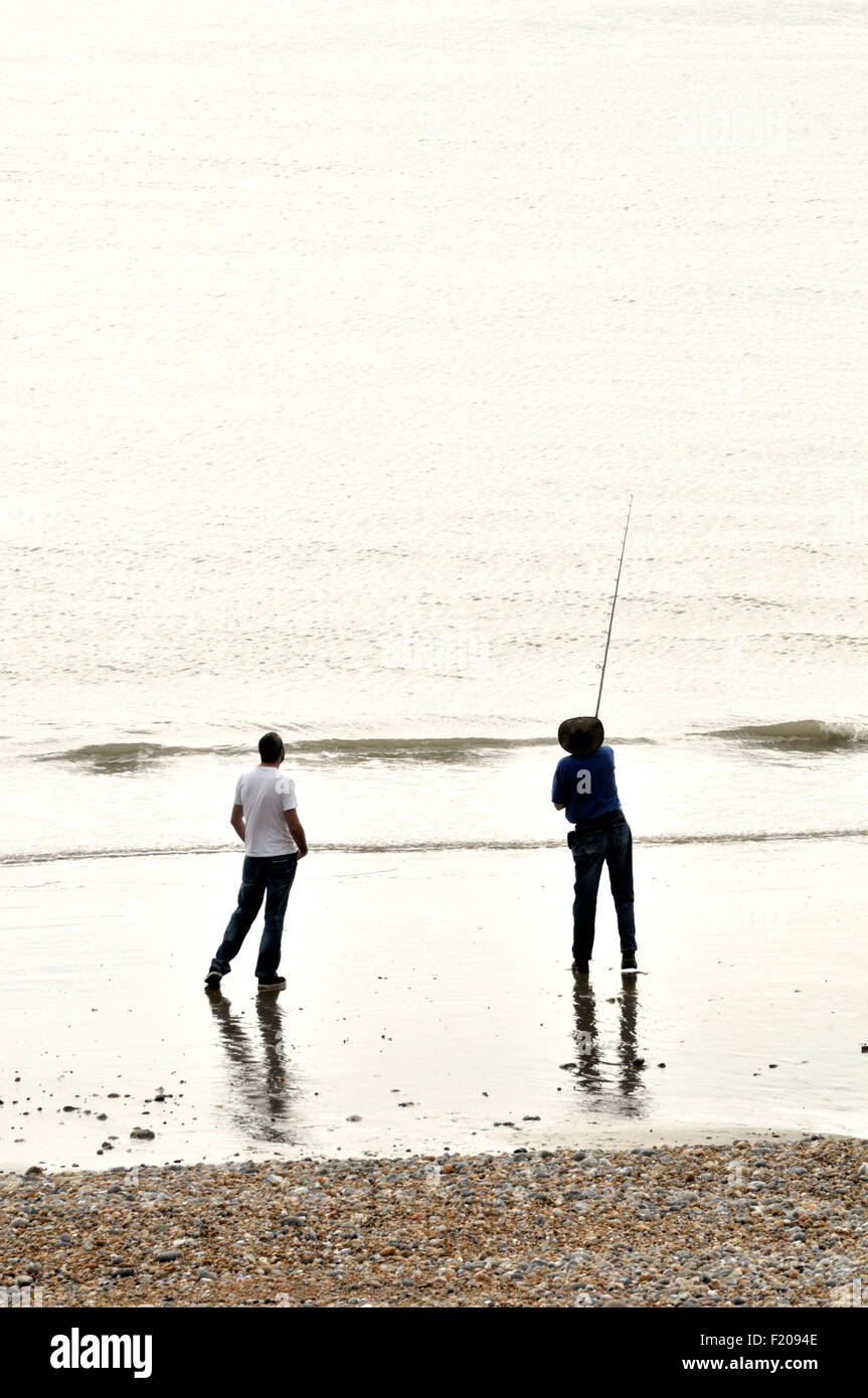 Two men fishing on the beach hi-res stock photography and images - Alamy