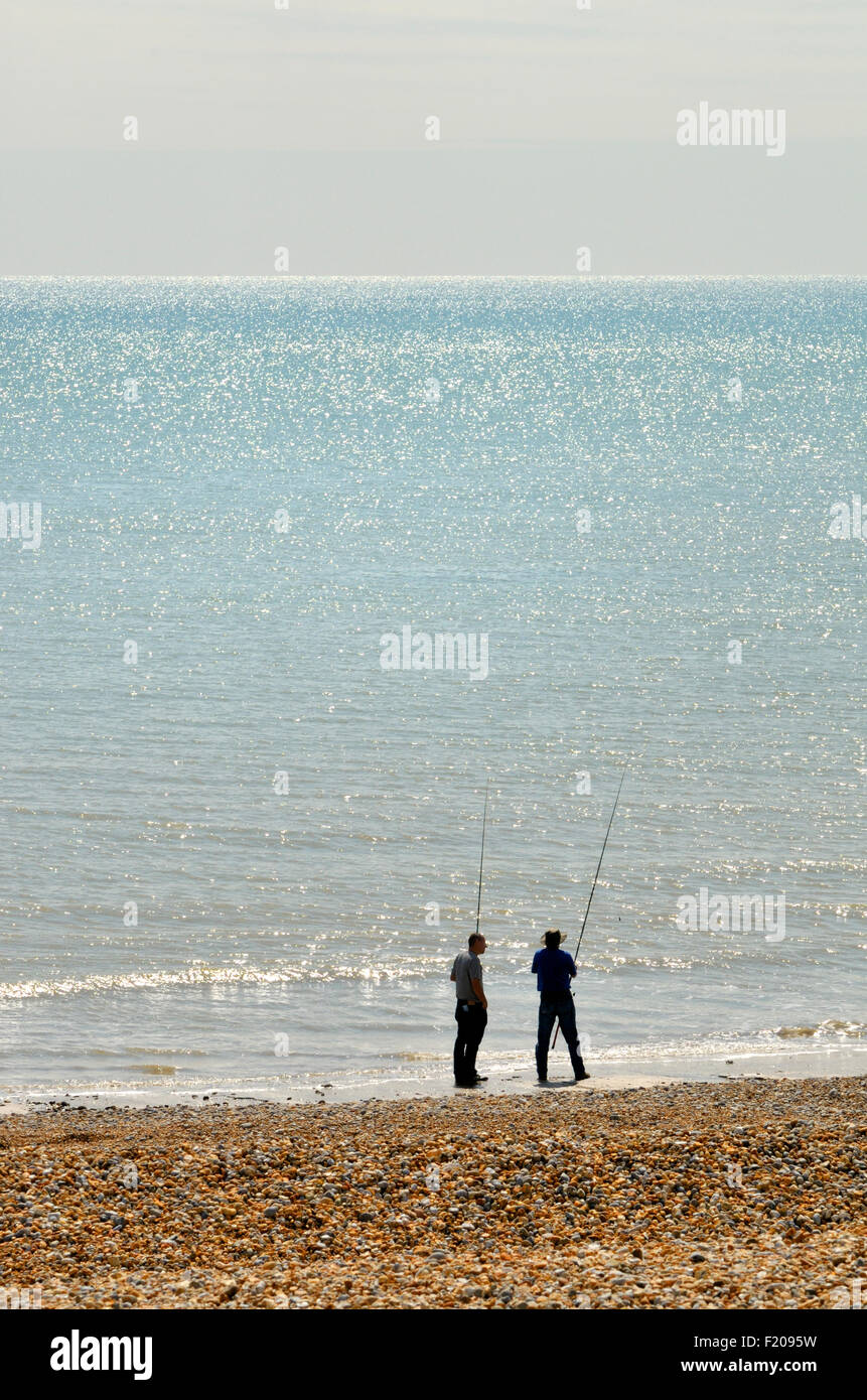Two men beach fishing hi-res stock photography and images - Alamy