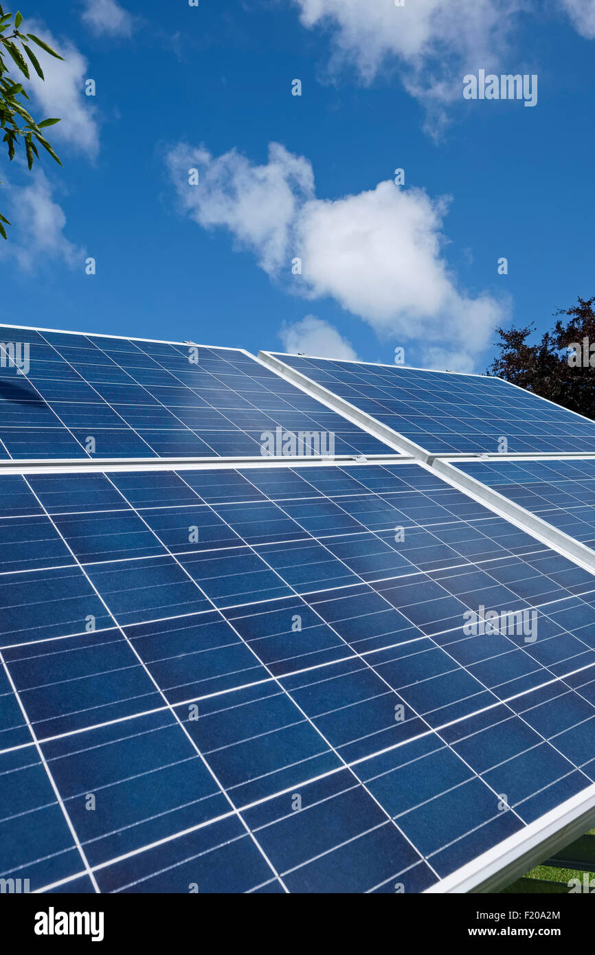 Ground based Solar Panels with Clouds in Blue Sky Stock Photo - Alamy