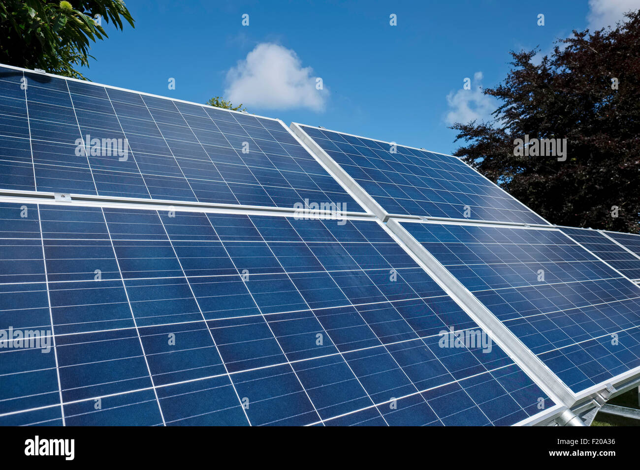 Ground based Solar Panels with Clouds in Blue Sky Stock Photo - Alamy