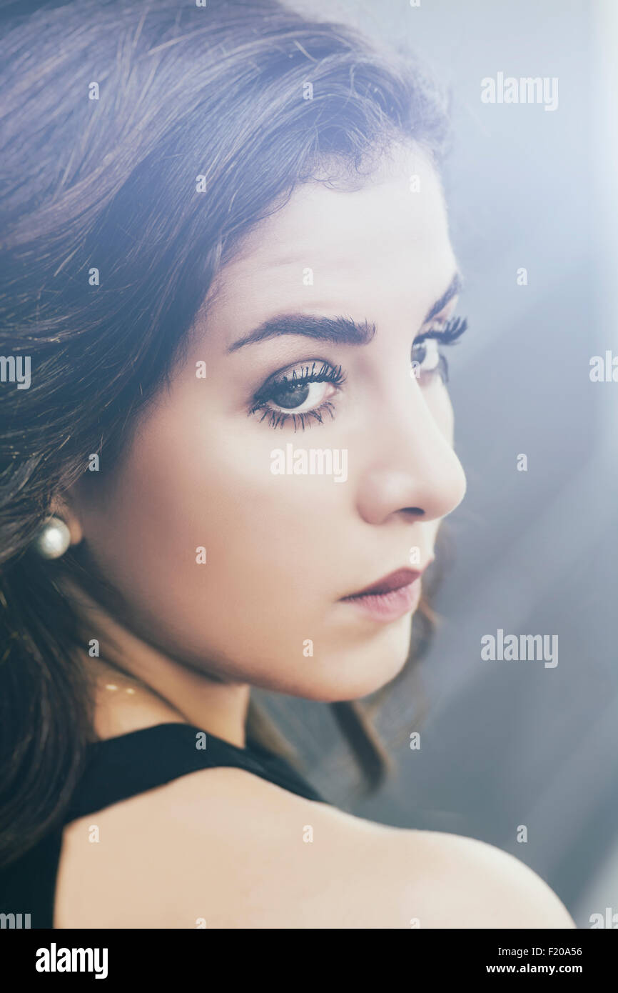 Beautiful young woman looking away Stock Photo - Alamy