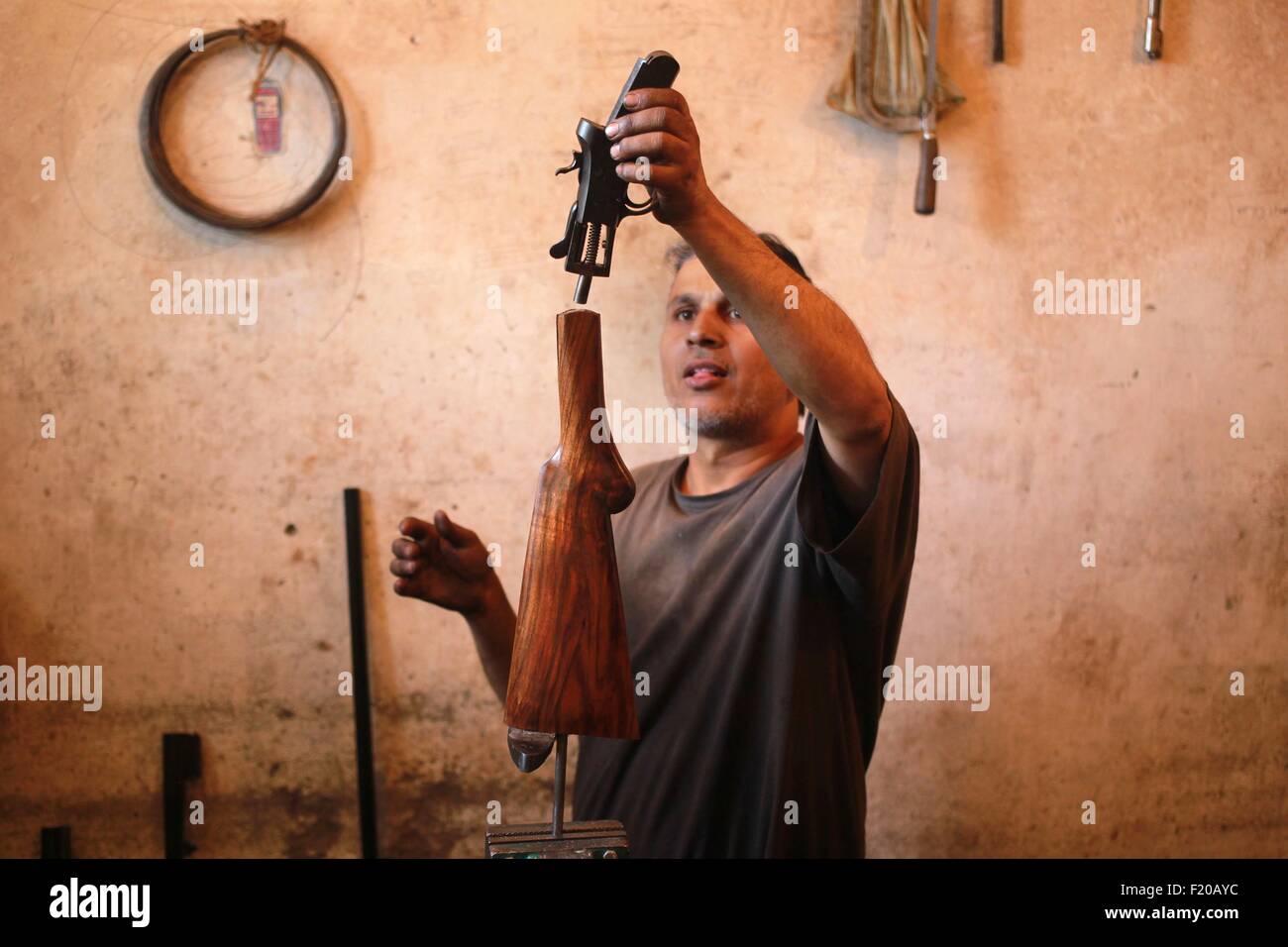 Srinagar, Indian-controlled Kashmir. 9th Sep, 2015. A gunsmith works at ...