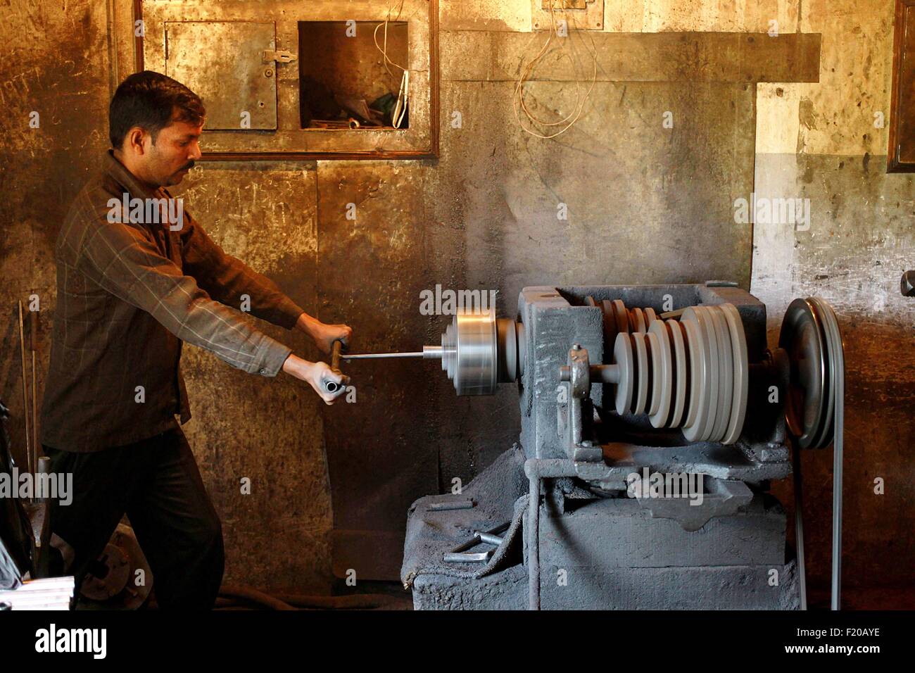 Srinagar, Indian-controlled Kashmir. 9th Sep, 2015. A gunsmith works at ...