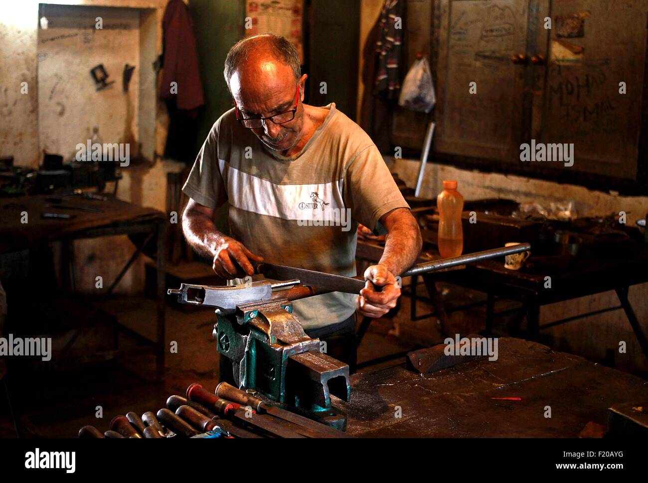 Srinagar, Indian-controlled Kashmir. 9th Sep, 2015. A gunsmith works at ...