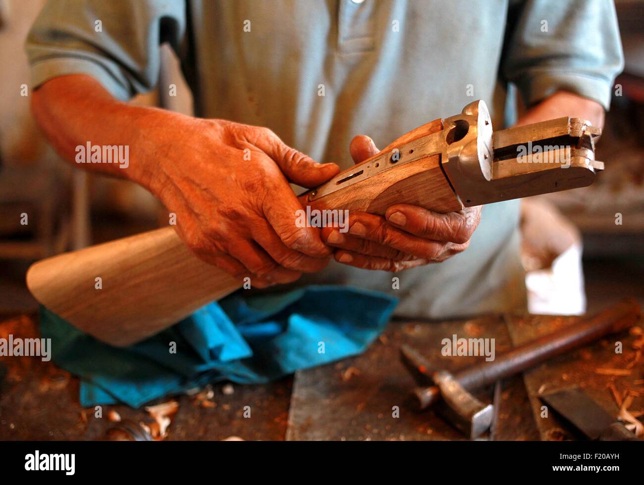 Srinagar, Indian-controlled Kashmir. 9th Sep, 2015. A gunsmith works at ...