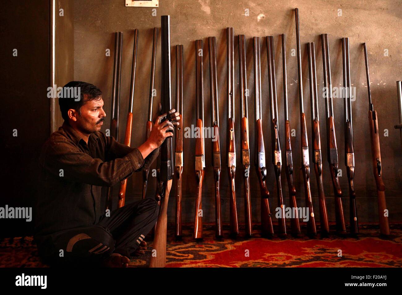 Srinagar, Indian-controlled Kashmir. 9th Sep, 2015. A gunsmith works at ...