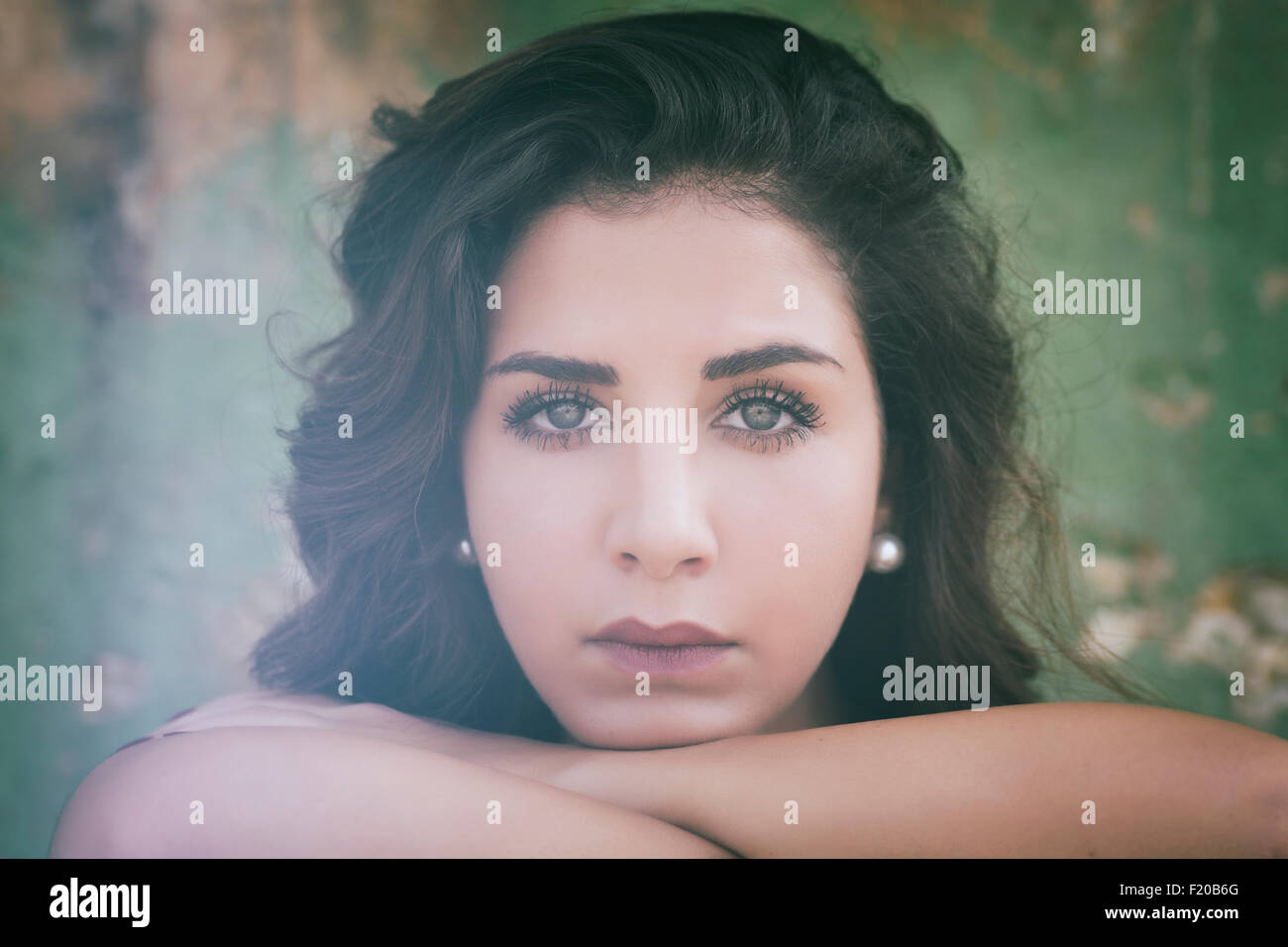 Beautiful young woman leaning on hands Stock Photo - Alamy