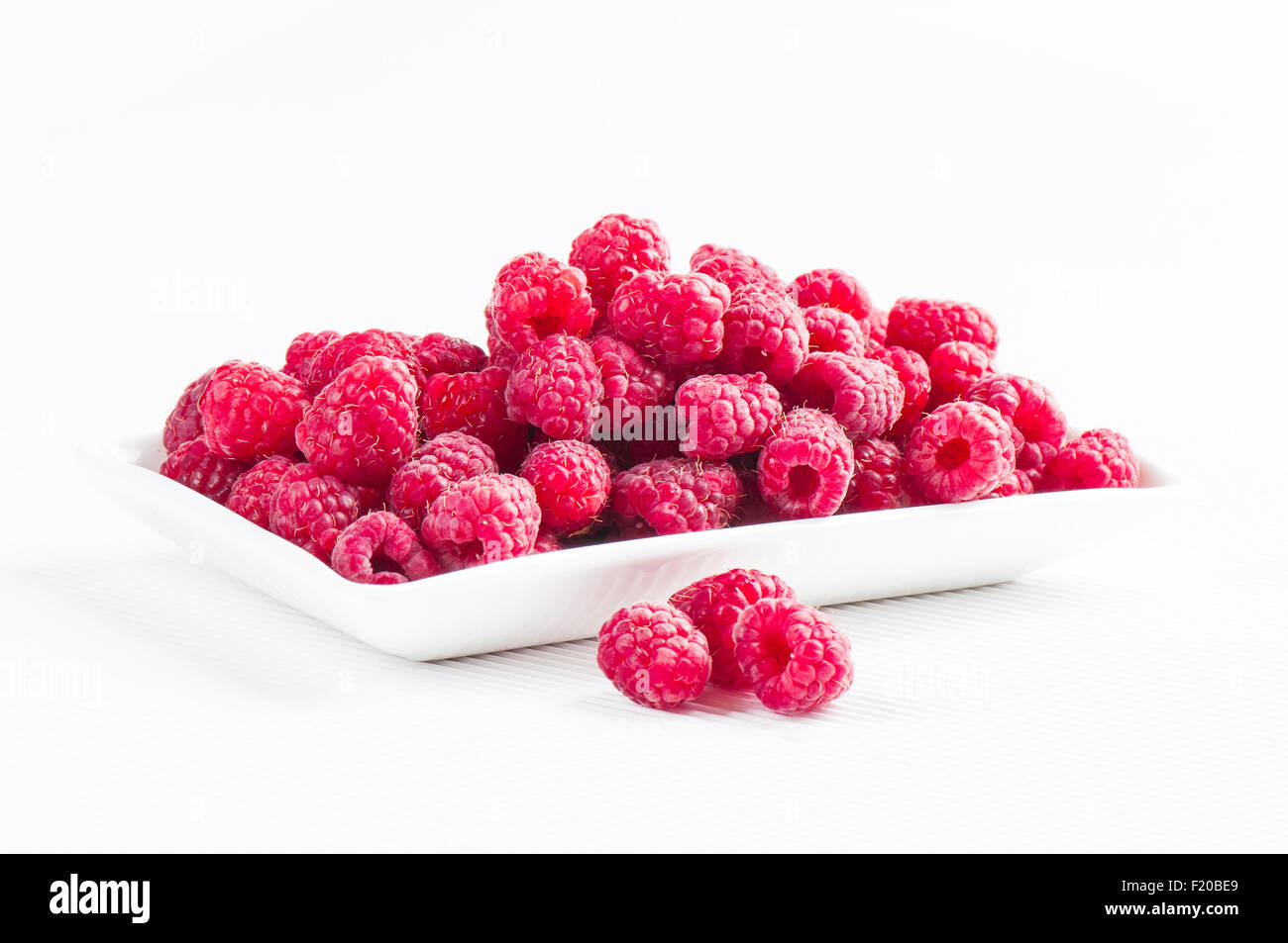 Fresh red raspberry isolated on white background Stock Photo - Alamy