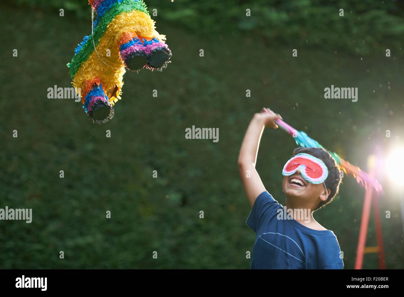 Boy hitting pinata hi-res stock photography and images - Alamy
