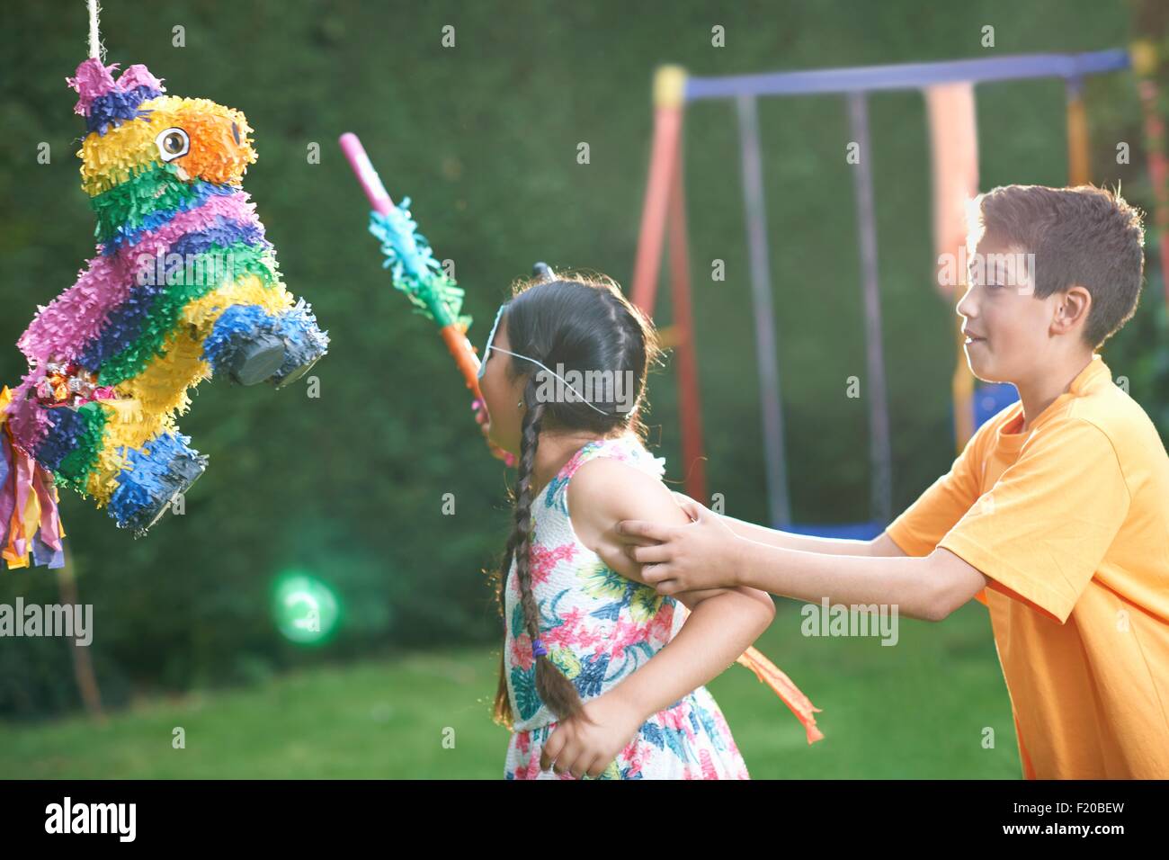 Boy hitting pinata hi-res stock photography and images - Alamy