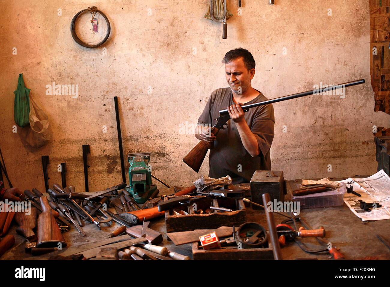 Srinagar, Indian-controlled Kashmir. 9th Sep, 2015. A gunsmith works at ...