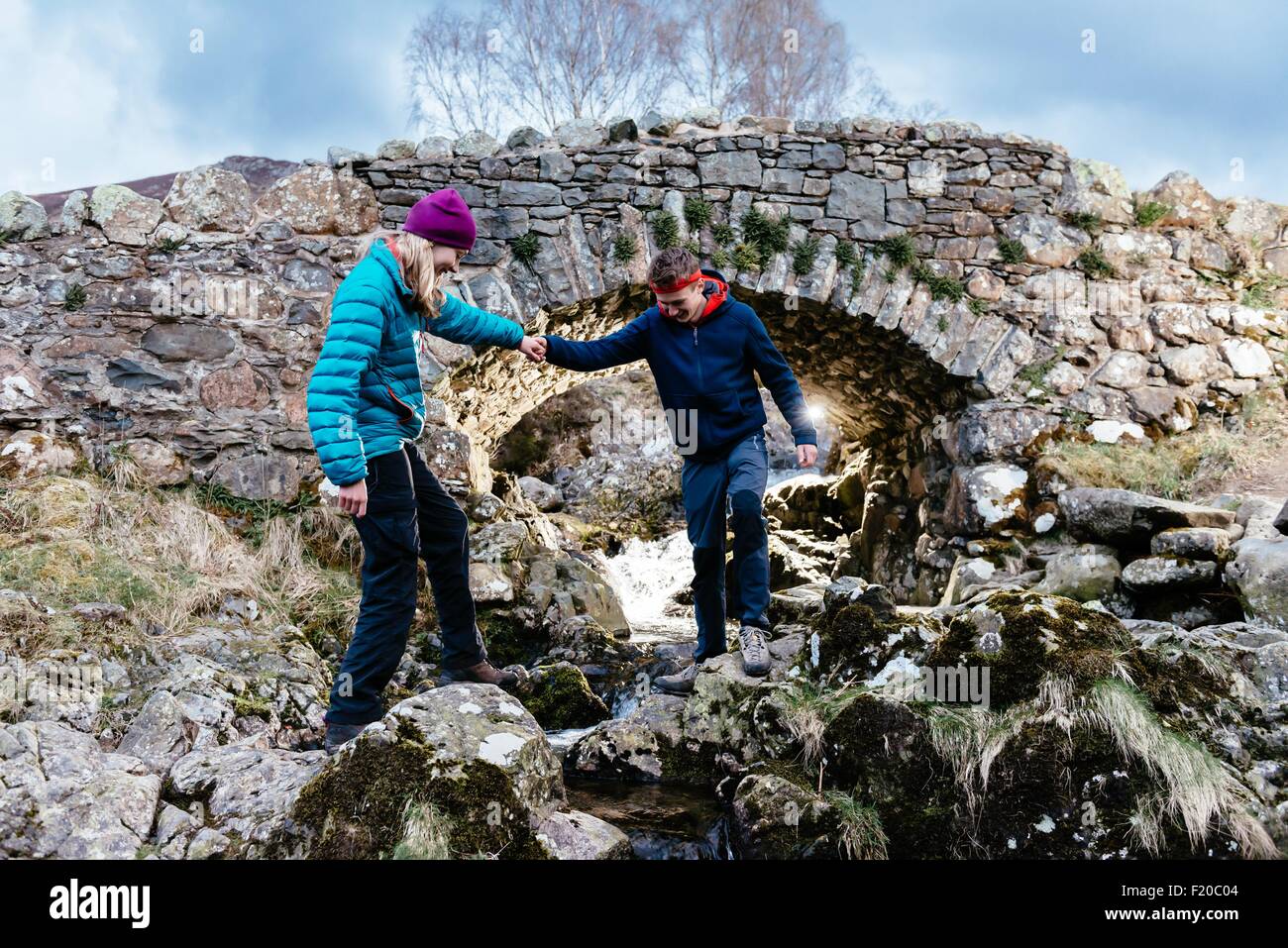Young couple hiking, Ashness Bridge, Keswick, Lake District, Cumbria ...