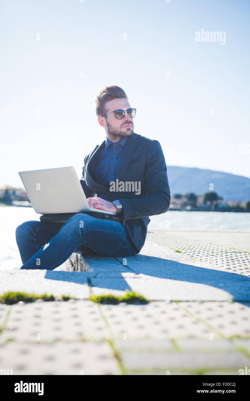 Over the shoulder man using laptop hi-res stock photography and images ...
