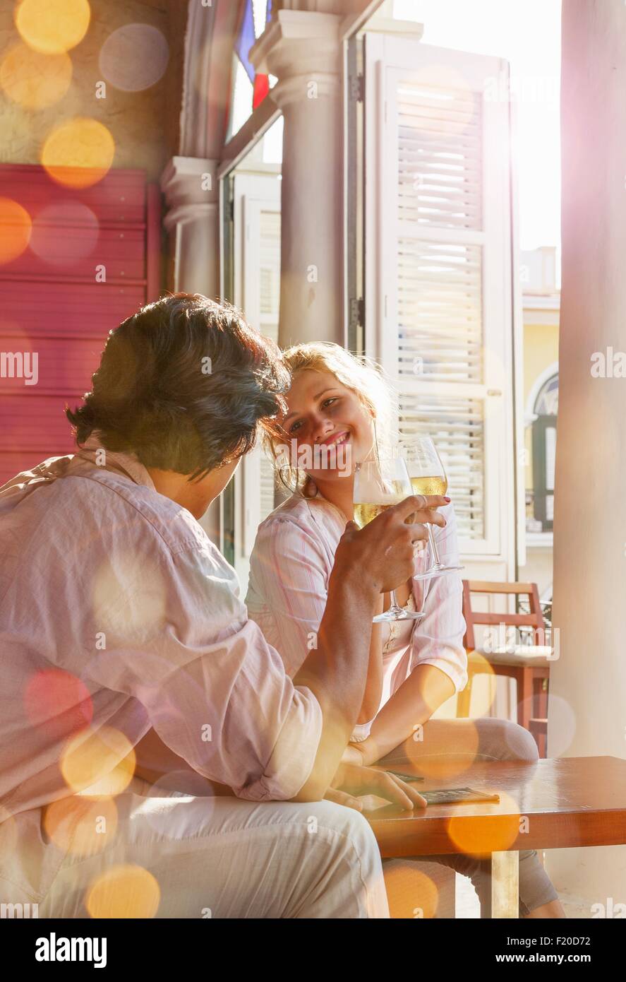 Young couple drinking wine in restaurant, Havana, Cuba Stock Photo - Alamy