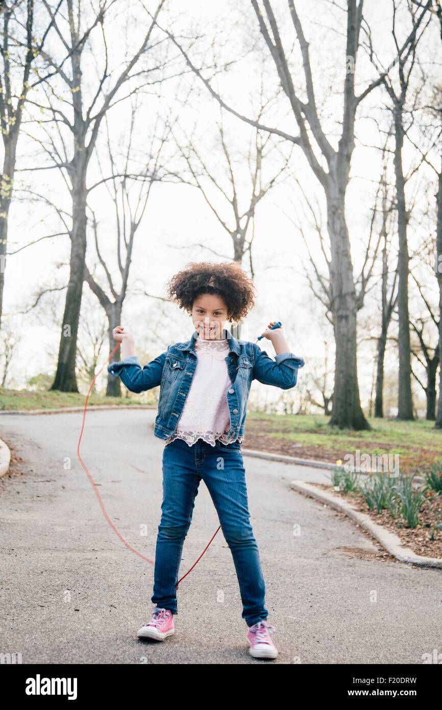 Girl playing skipping rope looking hi-res stock photography and images ...