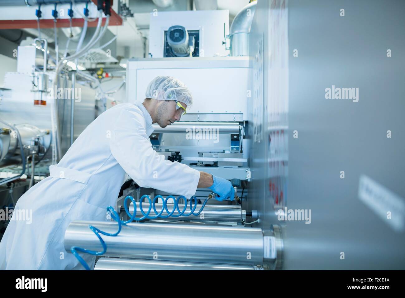 Male scientist power cable in lab cleanroom Stock Photo - Alamy