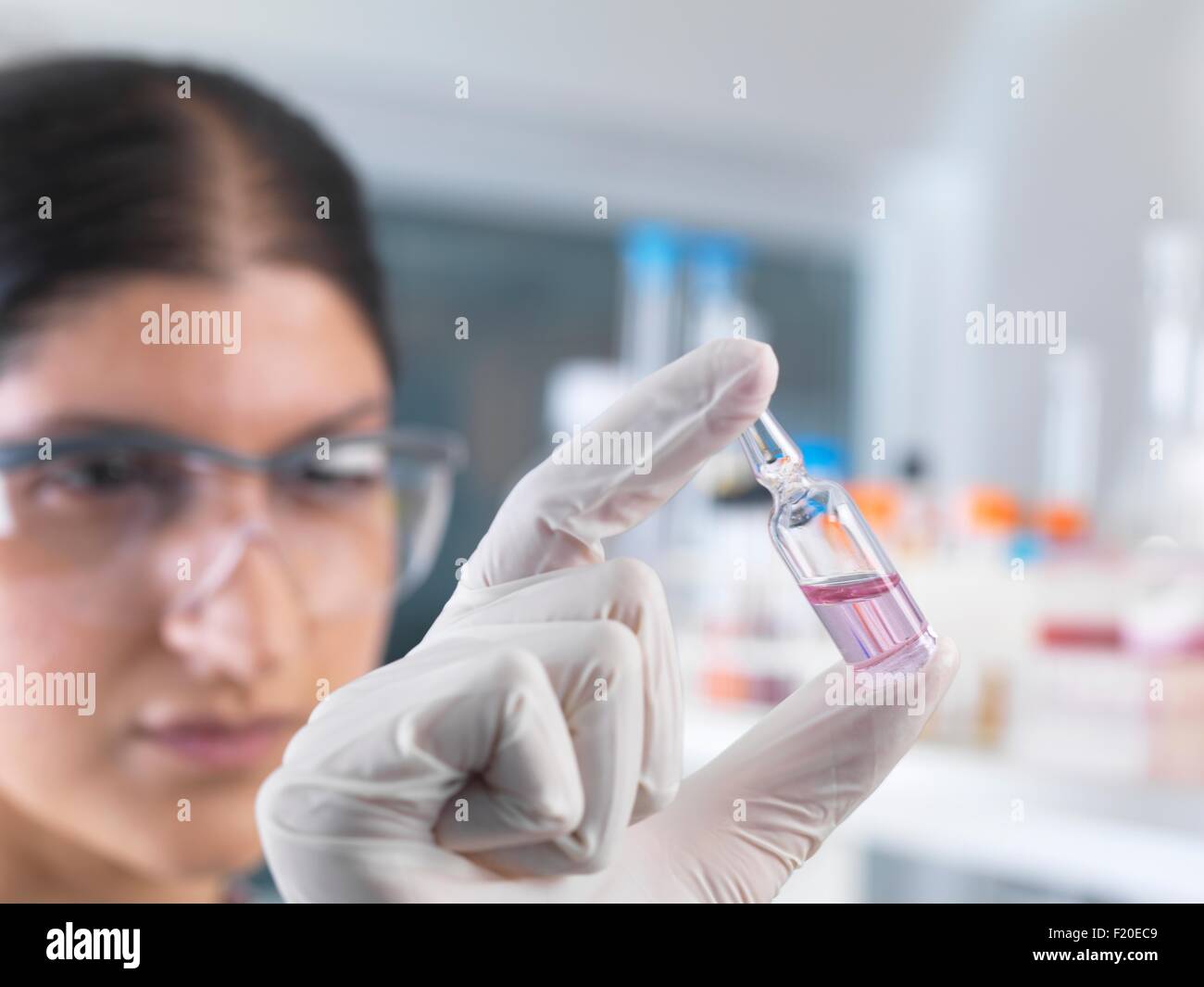 Female scientist testing medical drug ampule in laboratory Stock Photo ...