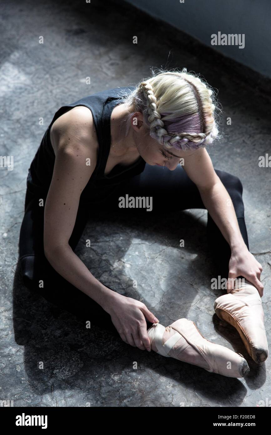 Dancer stretching in studio Stock Photo - Alamy